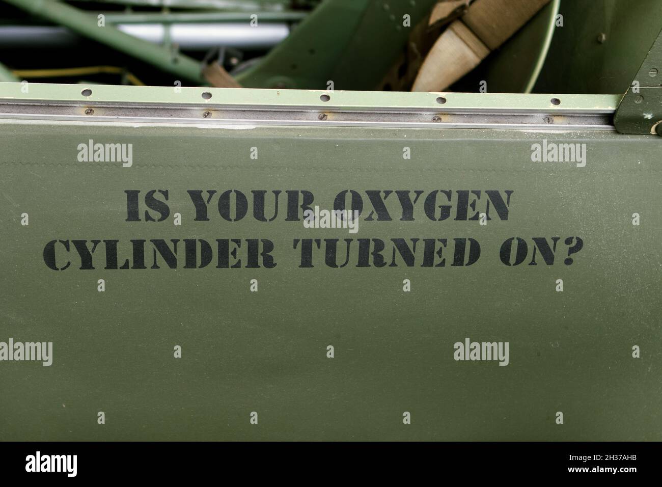 Military sign reading Is your Oxygen on? on the fuselage of the cockpit ...