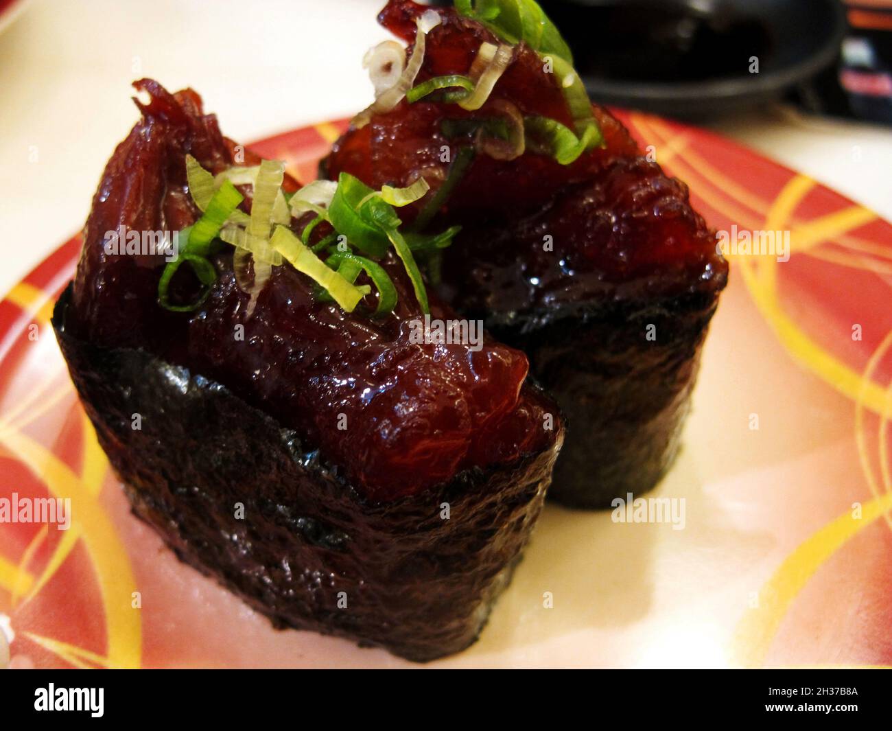 Sushi Traditional Japanese dish of prepared vinegared rice on topping ...
