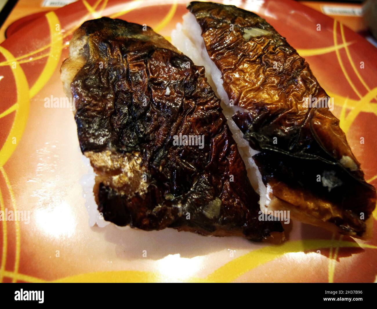 Sushi Traditional Japanese dish of prepared vinegared rice on topping ...