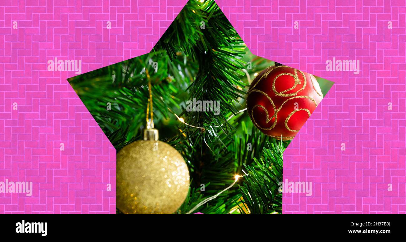 Composition of baubles on christmas tree in star shape on pink ...