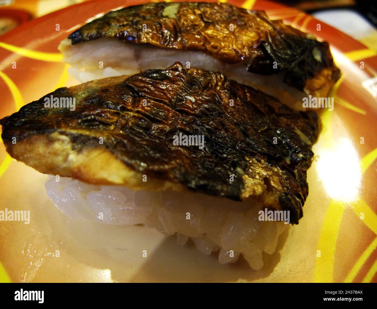 Sushi Traditional Japanese dish of prepared vinegared rice on topping ...