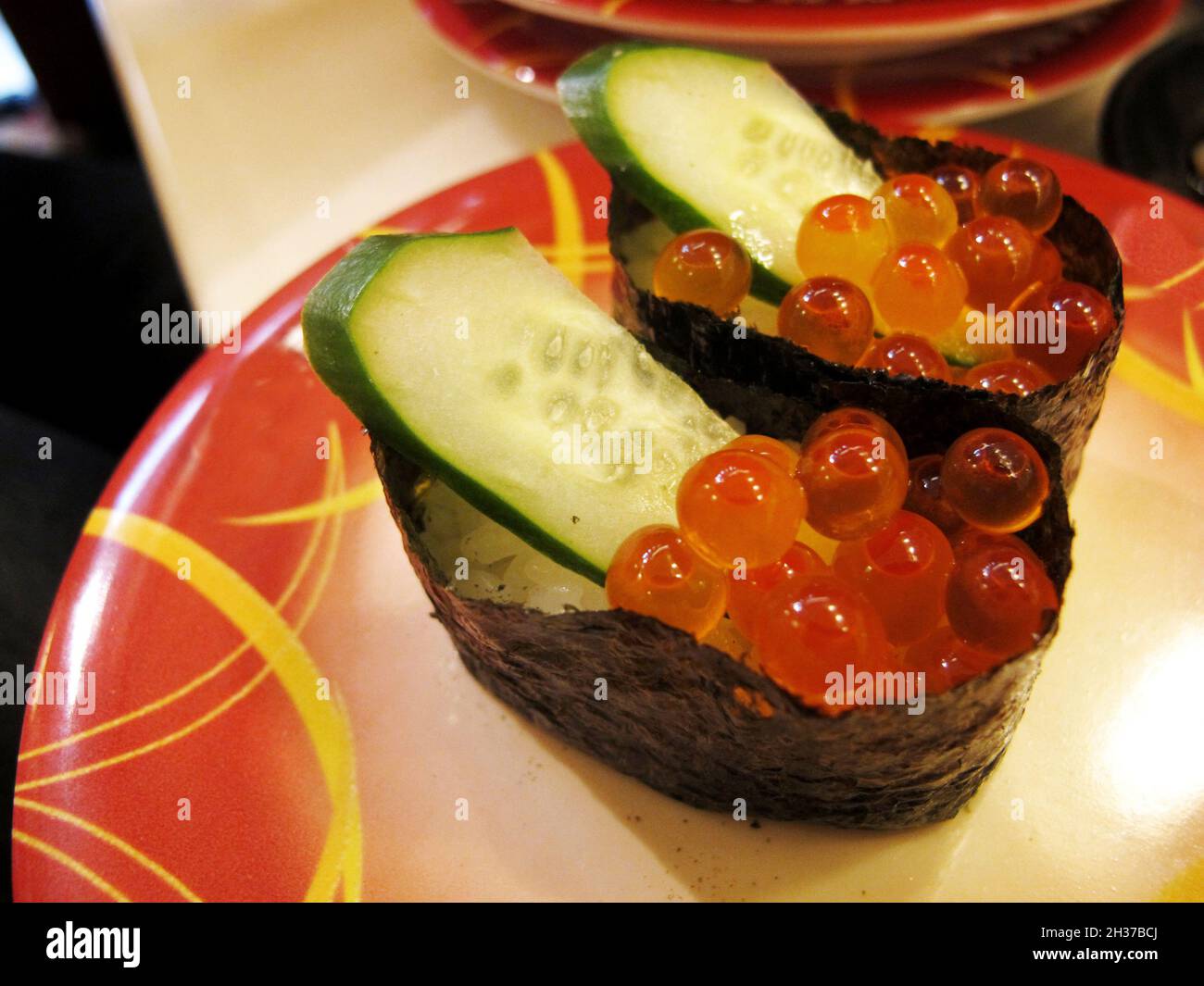 Sushi Traditional Japanese dish of prepared vinegared rice on topping ...