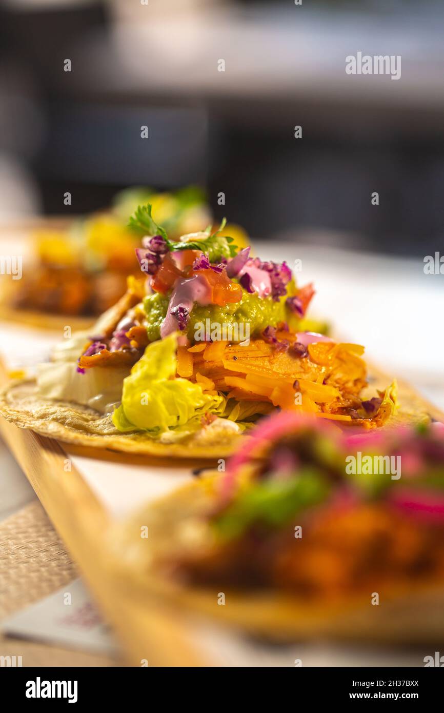 Tacos is a traditional Mexican dish consisting of a small corn or wheat ...