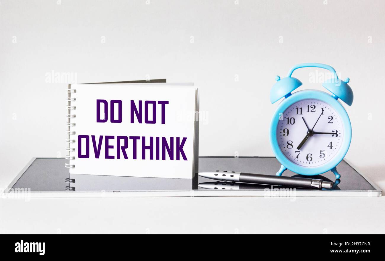do not overthink - motivational text on notepad with alarm clock ...