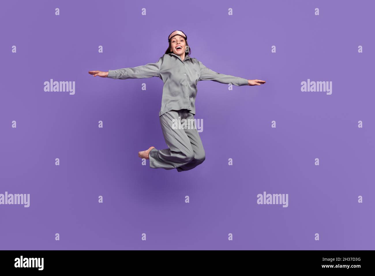 Full body photo of mature woman happy positive smile jump up hands ...