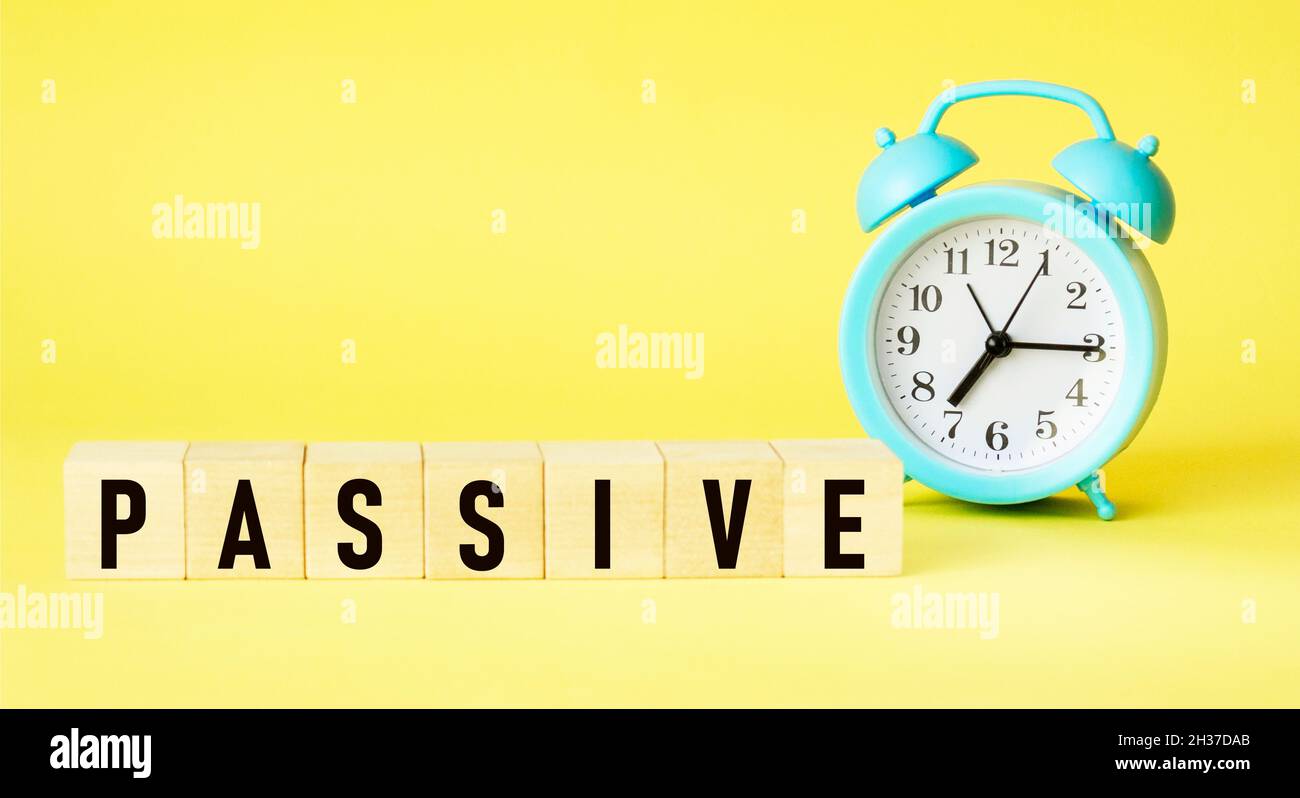 PASSIVE word made up of building blocks on a yellow background Stock ...