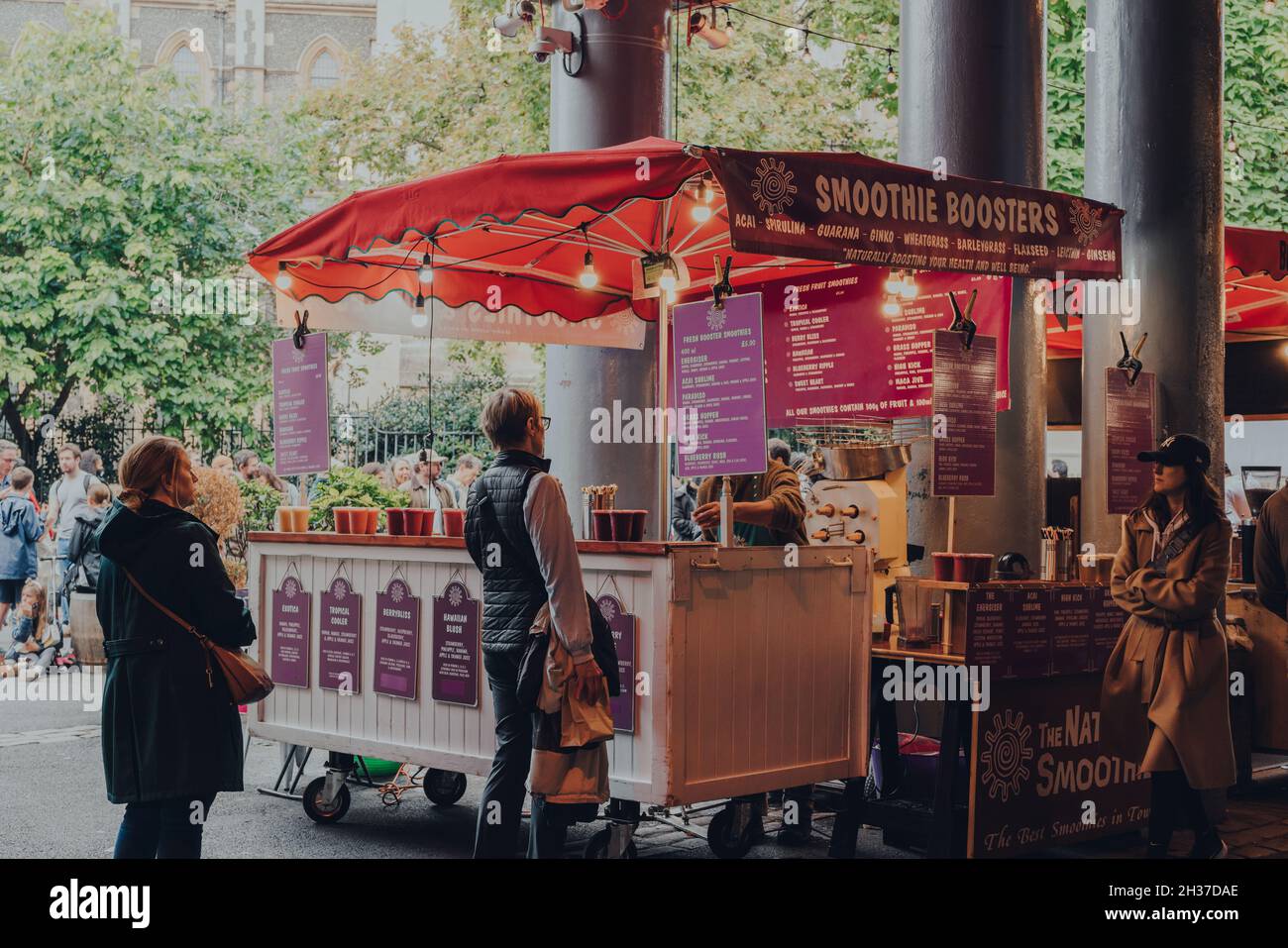 London, UK - October 17, 2021: Customers at a The Natural Smoothie ...