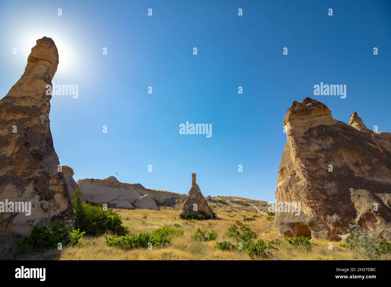 Fairy Chimneys or Peri Bacalari wtih sun on the background in Pasabagi ...