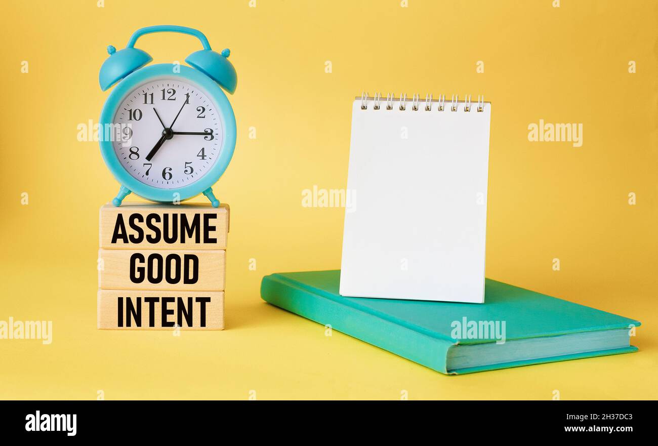 Assume good intentions. Inspirational quote on wooden blocks with ...