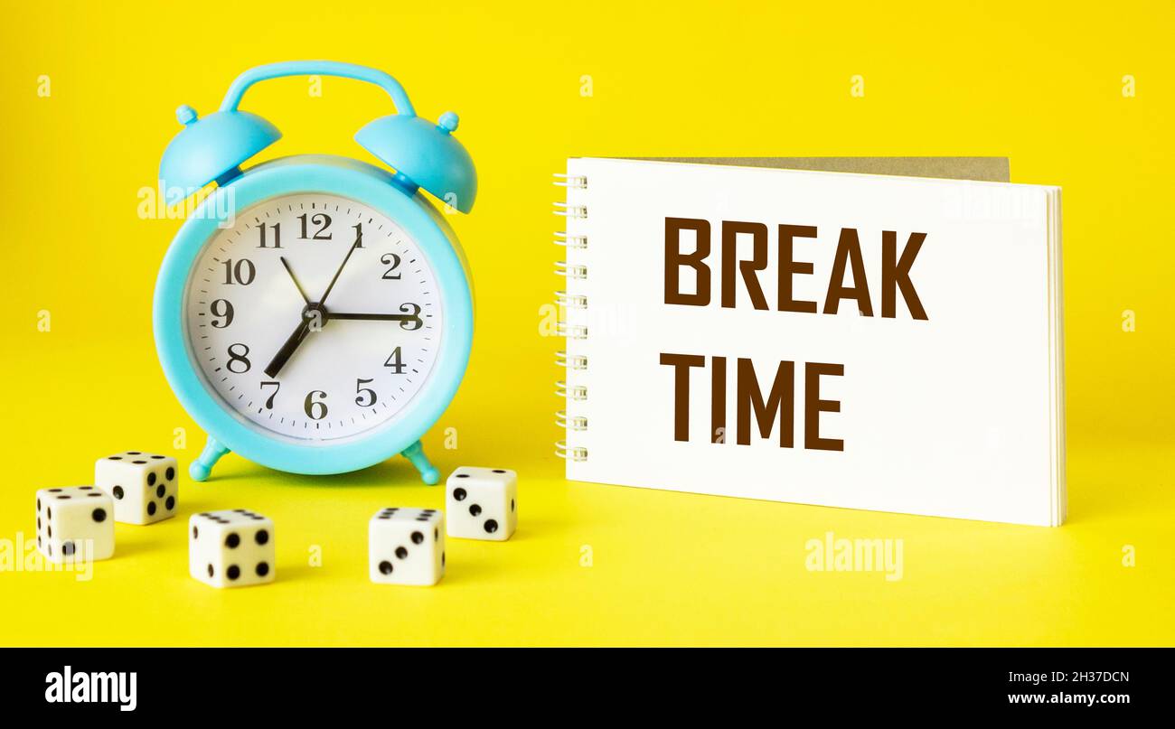 Notepad with the words Time Break on a yellow background with a clock ...