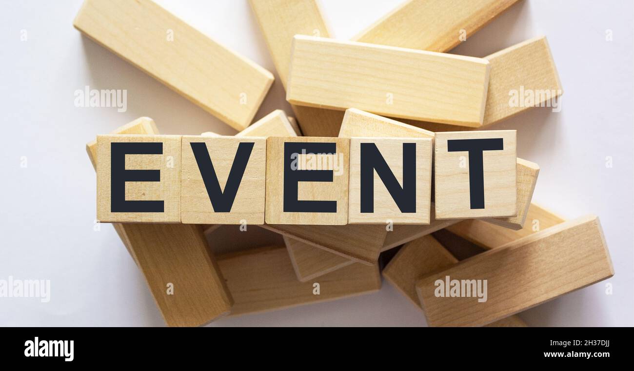 Event word written in wooden cube and white background Stock Photo - Alamy
