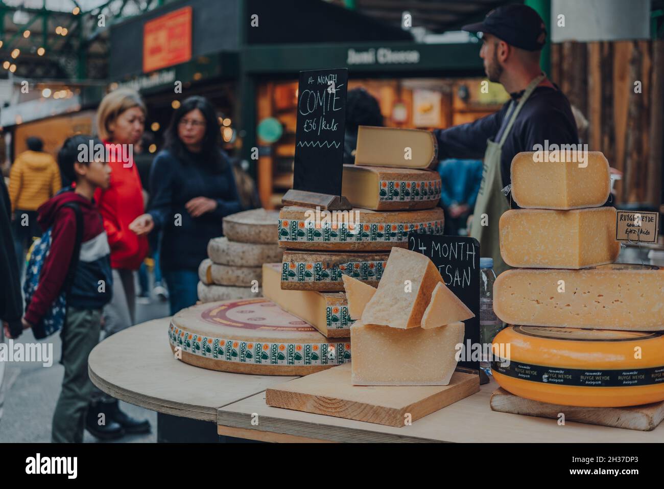 London, UK - October 17, 2021: Variety of cheese wheels on sale at a ...