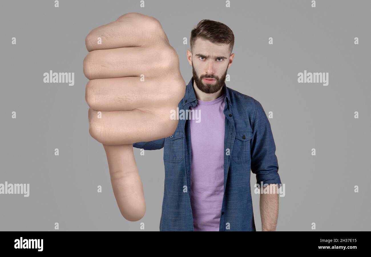 Young man showing thumb hi-res stock photography and images - Alamy