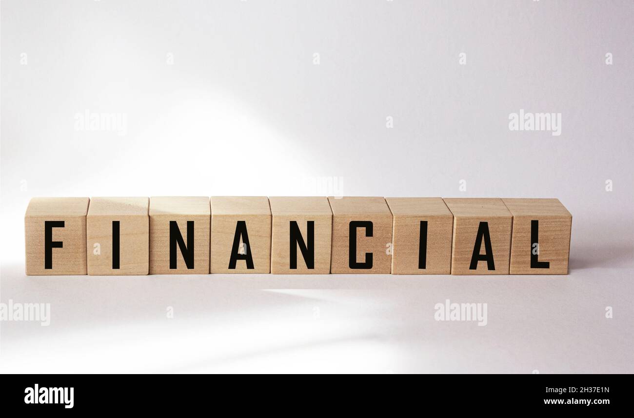 The word financial written by wooden cubes. Financial rise and fall ...