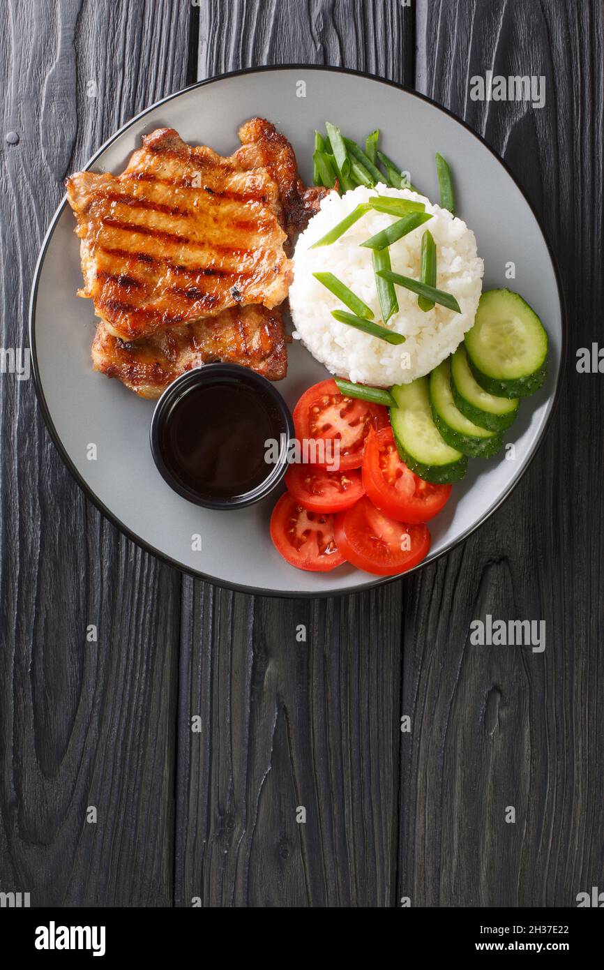 Saigon food fluffy broken rice with grilled pork chops and an ...