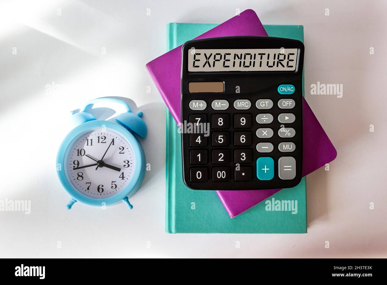 Calculator with the word EXPENDITURE on the display of the calculator ...