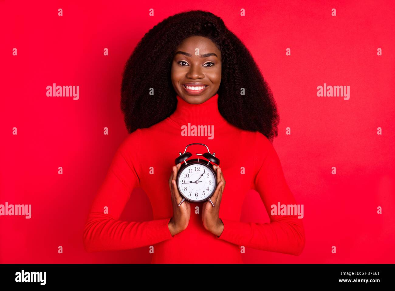 Photo of young black woman happy positive smile hold timer clock alarm ...