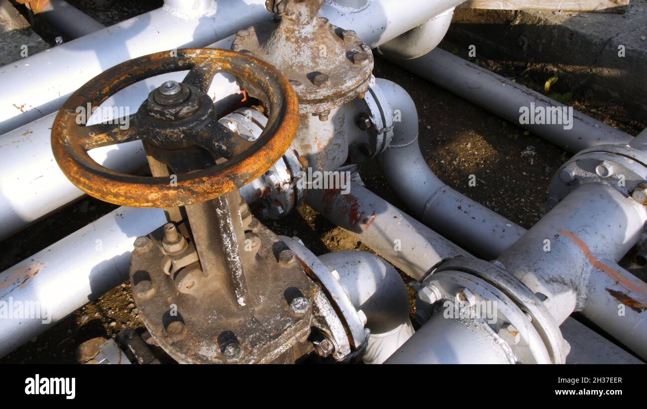 Old fuel transfer valves on a building in the industrial area. Stock ...
