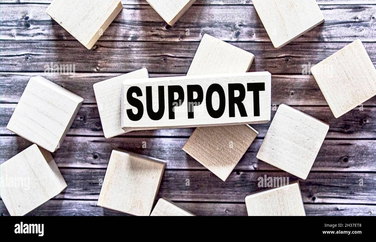 Customer support concept with letters on cubes. Still life of office ...