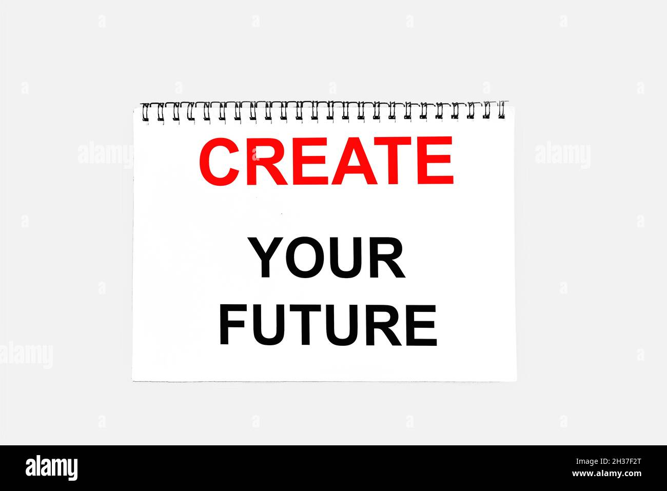 Create your future, text is written on white sticky note and gray ...