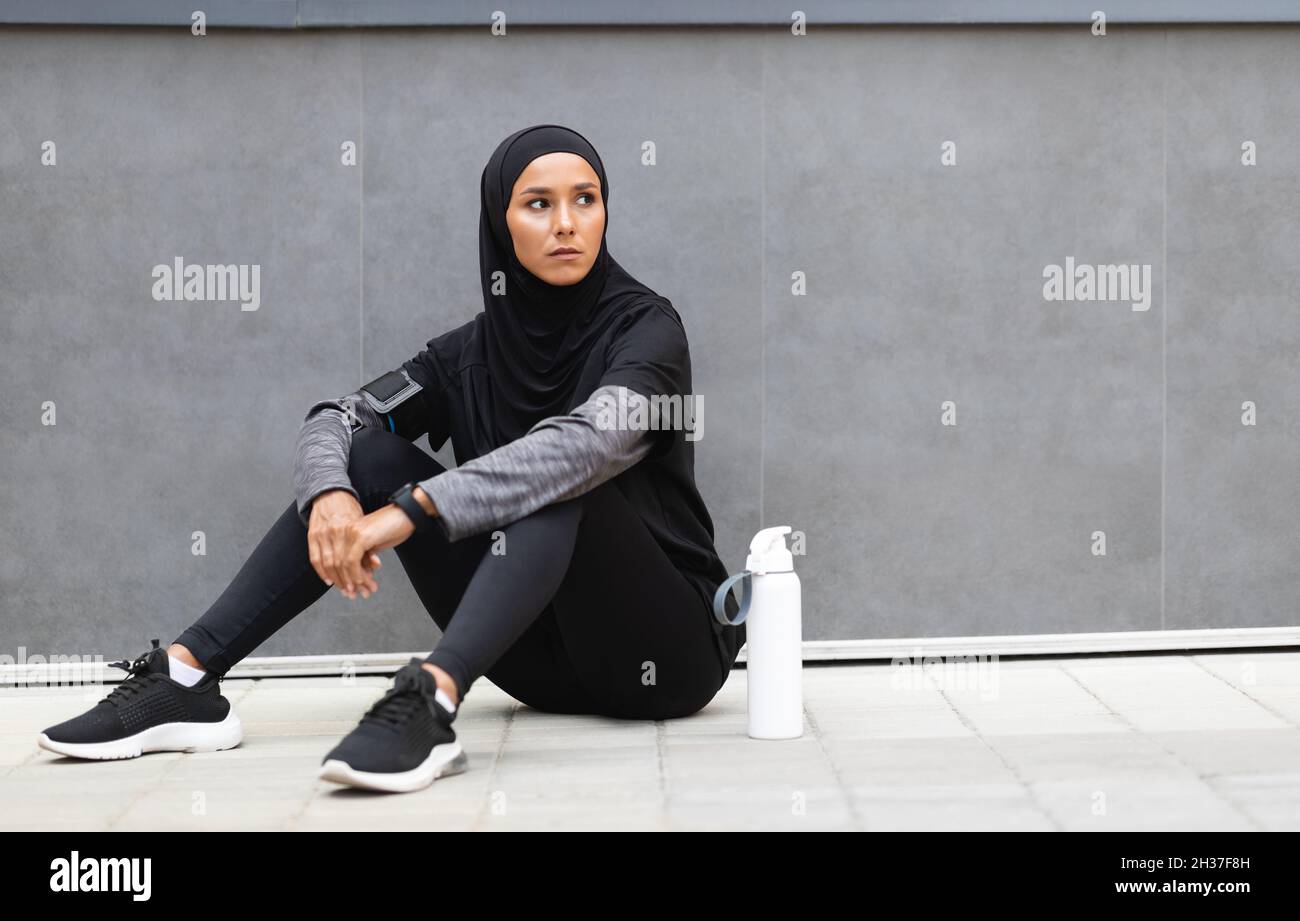 Sport For Muslim Women. Islamic Lady In Sportswear Relaxing After ...