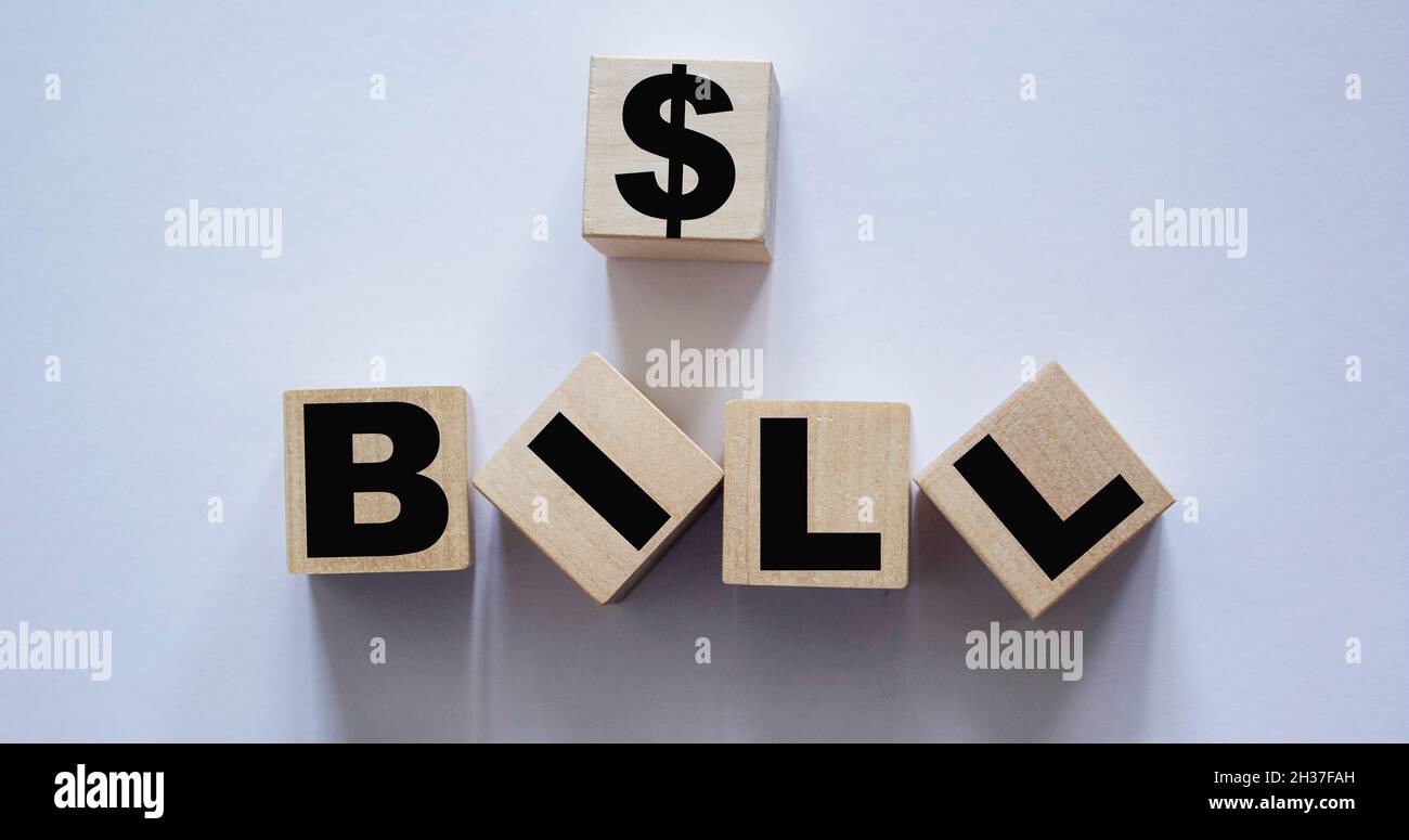 Text BILL on wood cube block, stock investment concept Stock Photo - Alamy