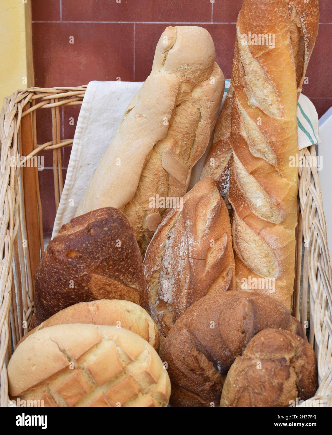 Basket of assorted bread in bakery showcase Stock Photo - Alamy