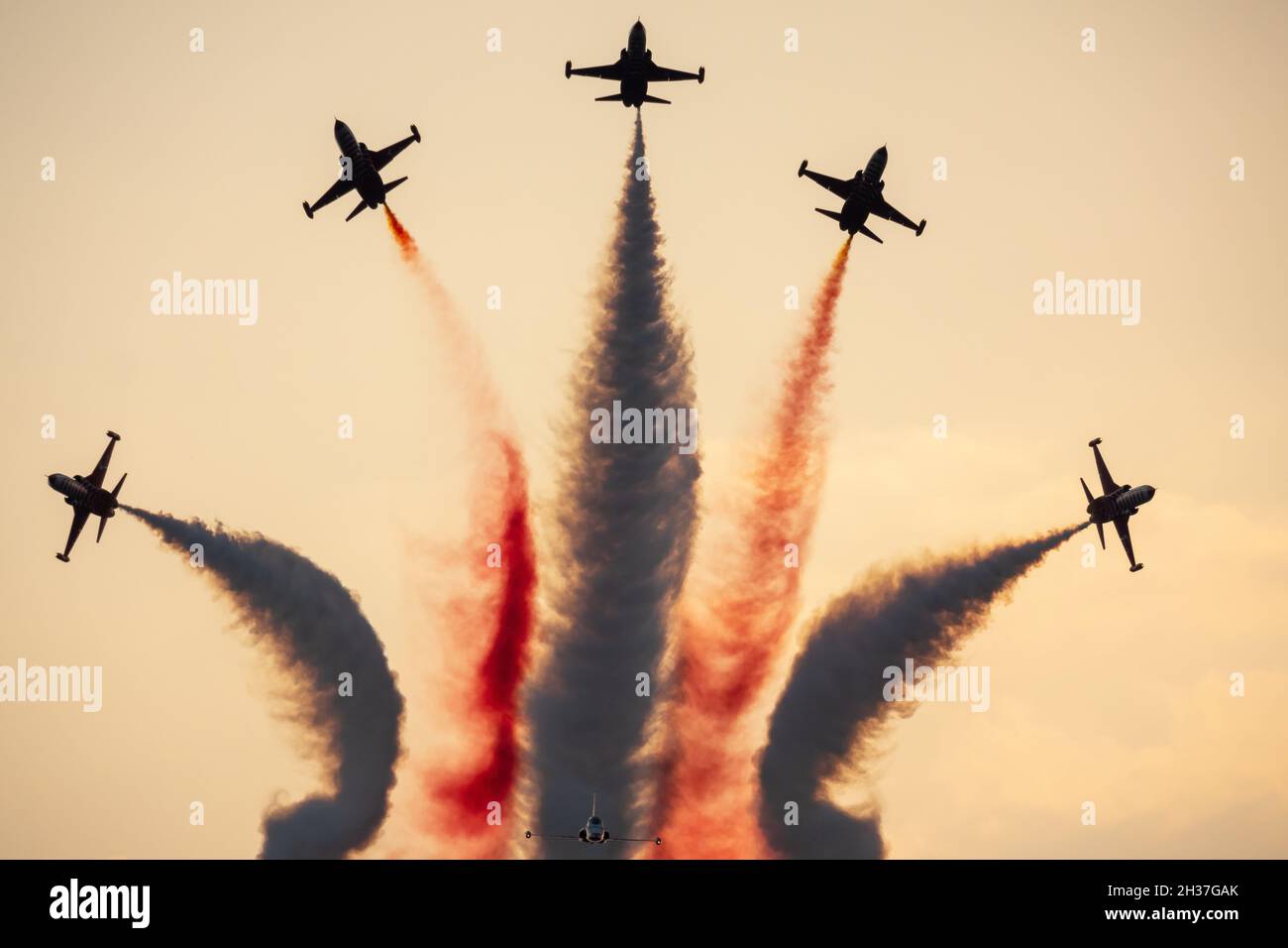 Air show with the planes leaving a colorful smoke trace Stock Photo - Alamy