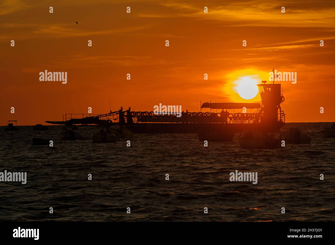 Sunset behind the river fishing boats Stock Photo - Alamy