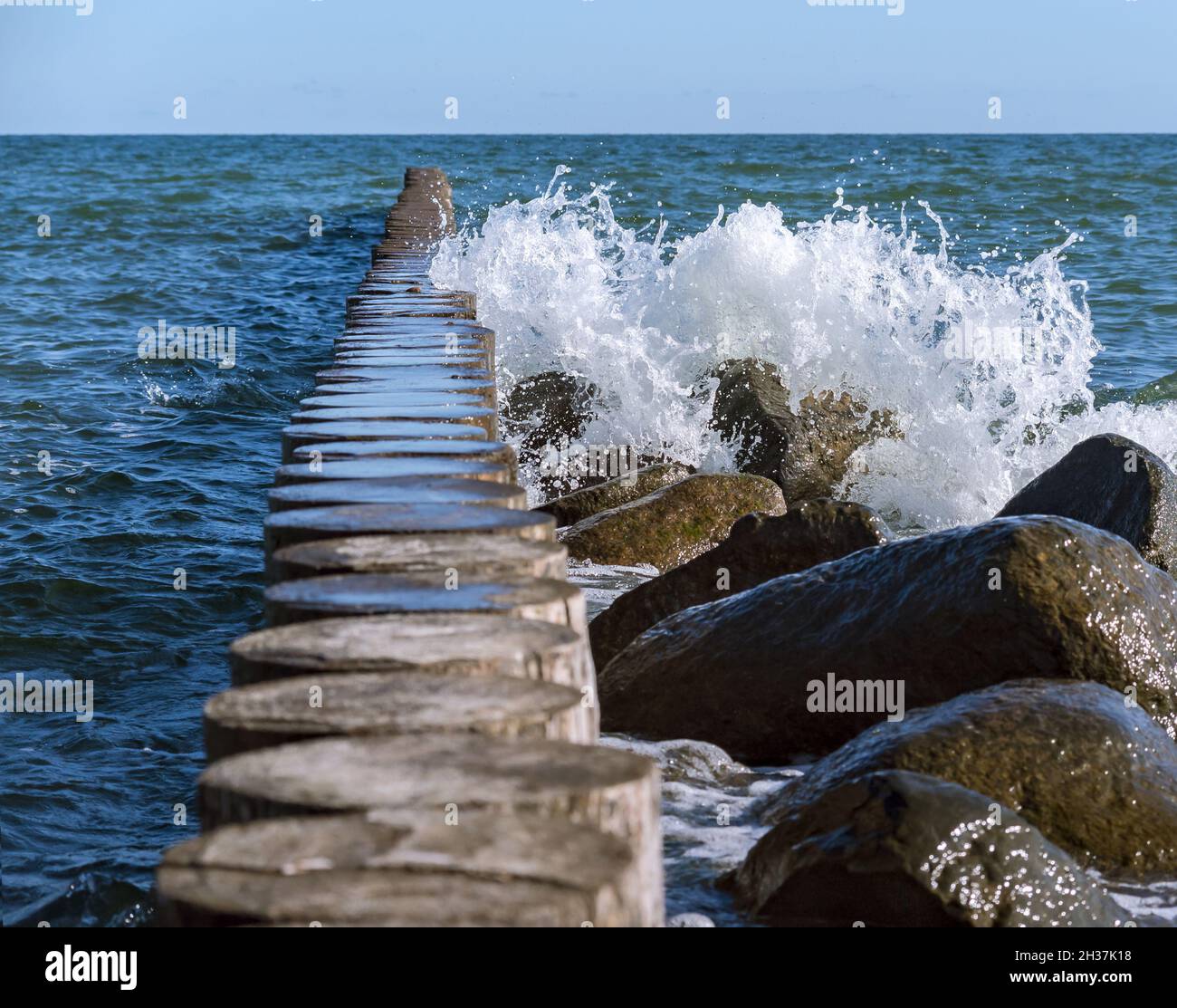 Waves and a storm at sea. Waves crashing on breakwaters. Sea wave ...