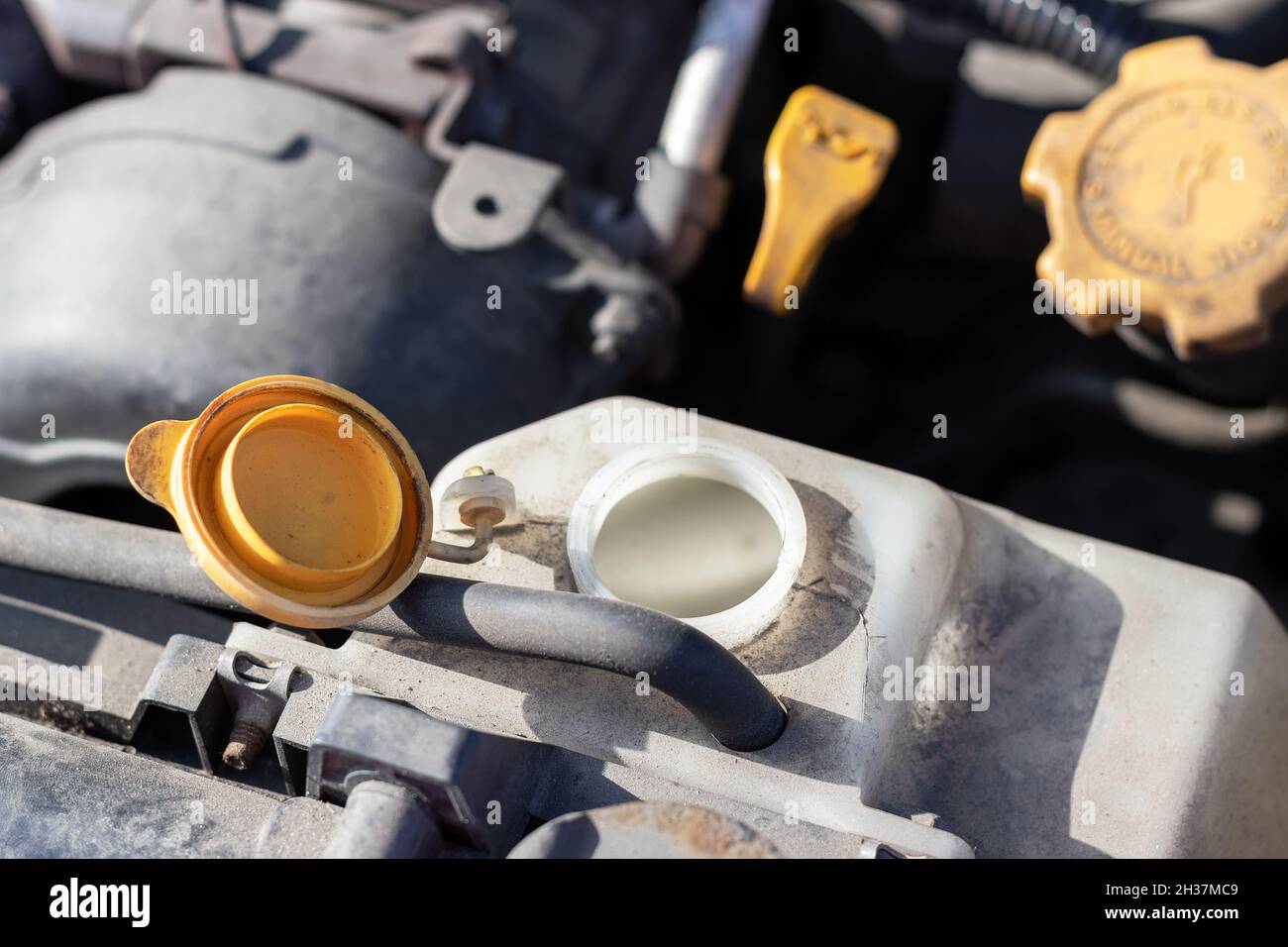 Open lid on an antifreeze tank. Dusty details of a flat-four (boxer ...