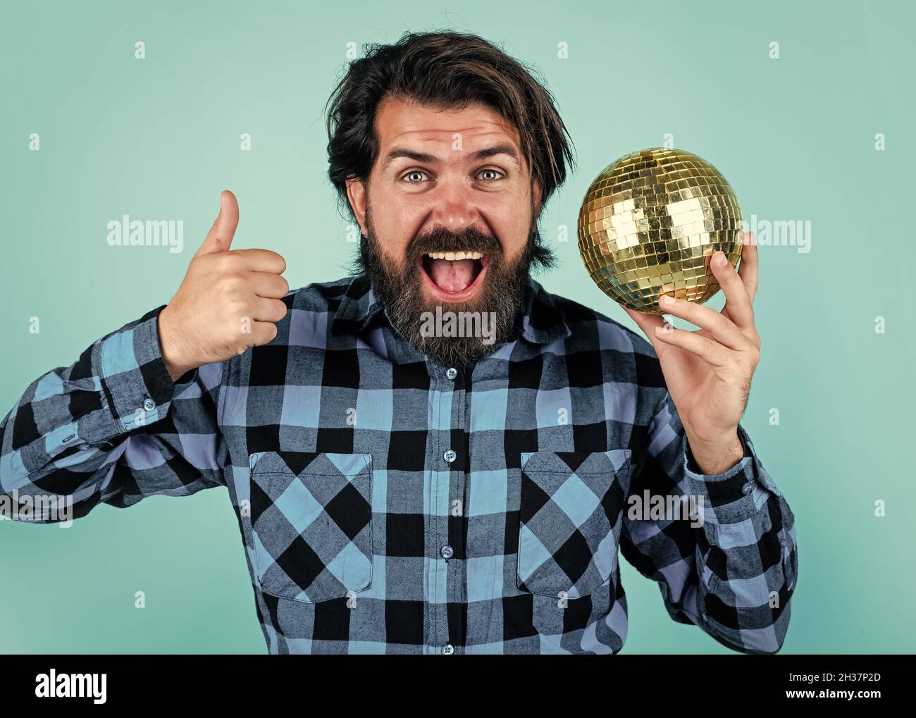 happy man celebrating party with disco ball and showing thumb up, lets ...