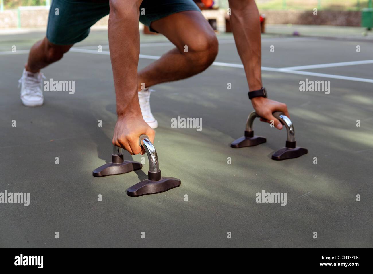 man doing push-ups on the court. bali Stock Photo - Alamy