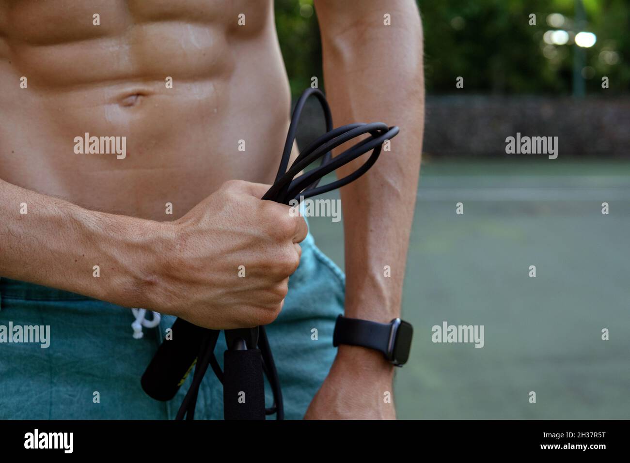 a man doing with rubber bands. bali Stock Photo - Alamy
