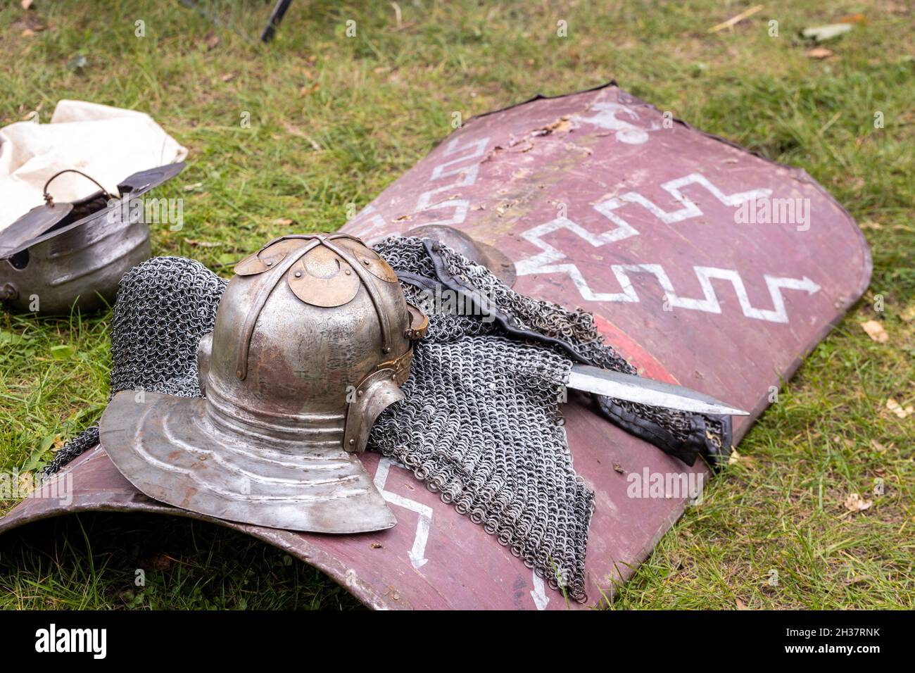 Equipment of a Roman legionnaire on the ground, Shield, helmet, sword ...