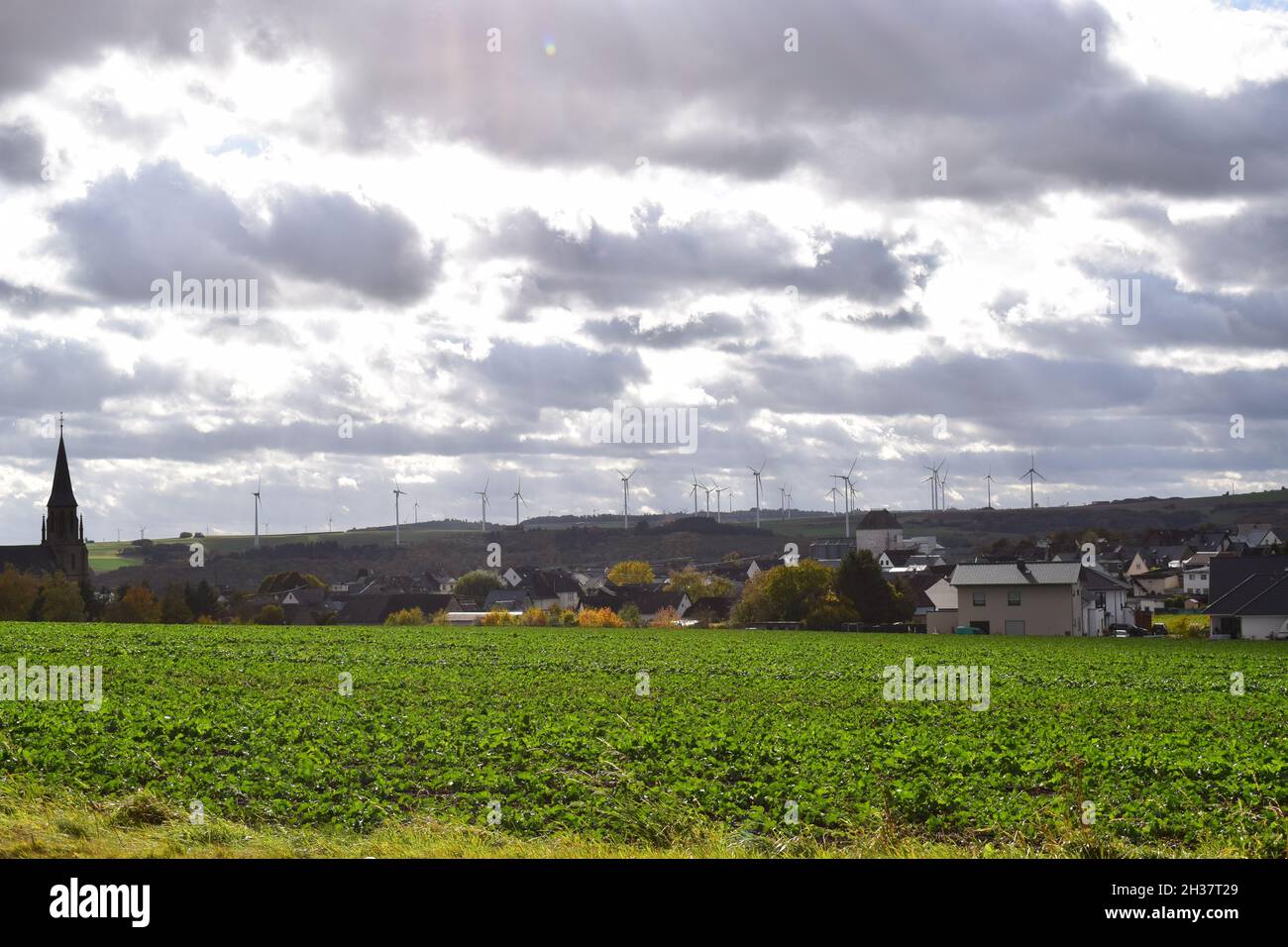 Eifel village Kehrig with wind power plants Stock Photo - Alamy