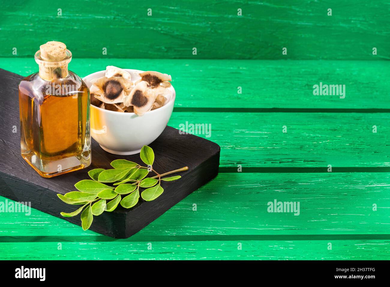 Moringa oil, leaves and seeds - Moringa oleifera Stock Photo - Alamy