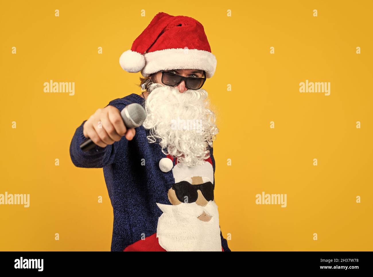 santa claus bearded man singer hold microphone wish happy new year and ...
