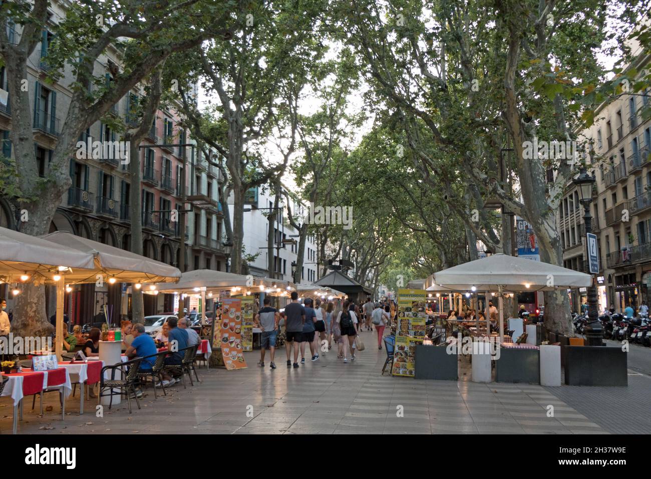 Urban view of Barcelona, Spain with people and tourists walking on La ...