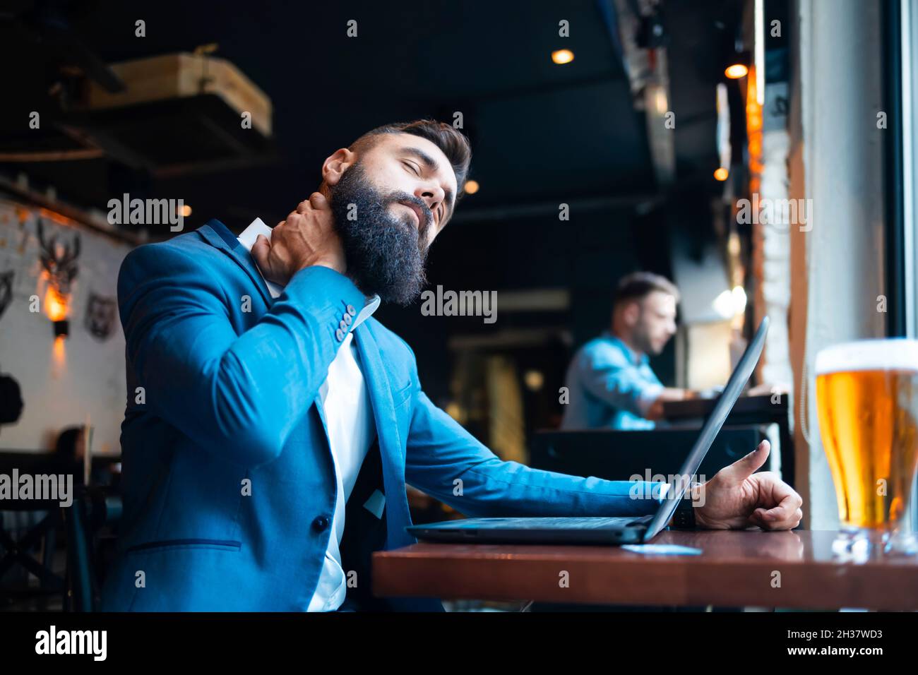 A businessman tired after a long day Stock Photo - Alamy