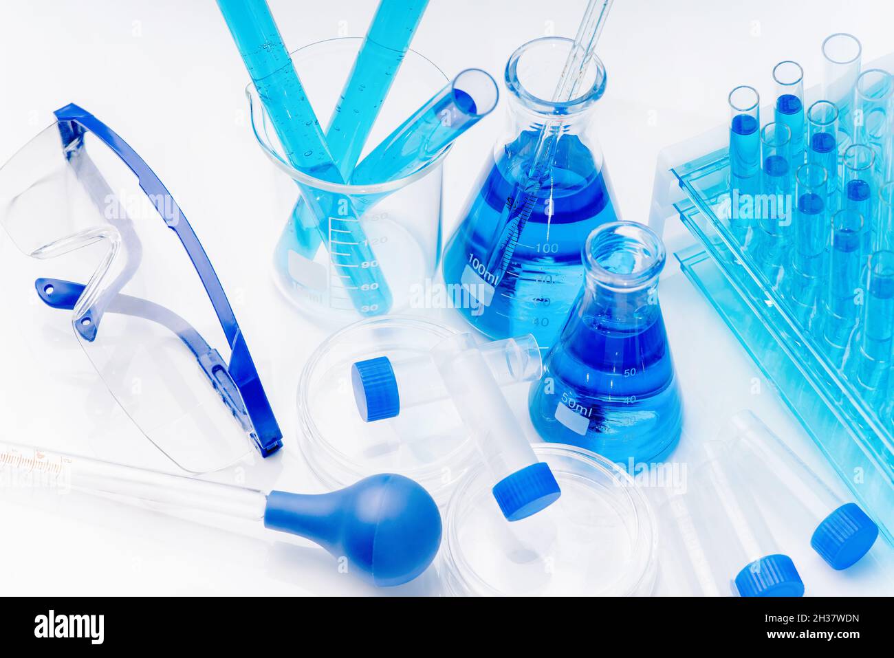 Collection of medical flasks on a blue background.Science glass flask ...