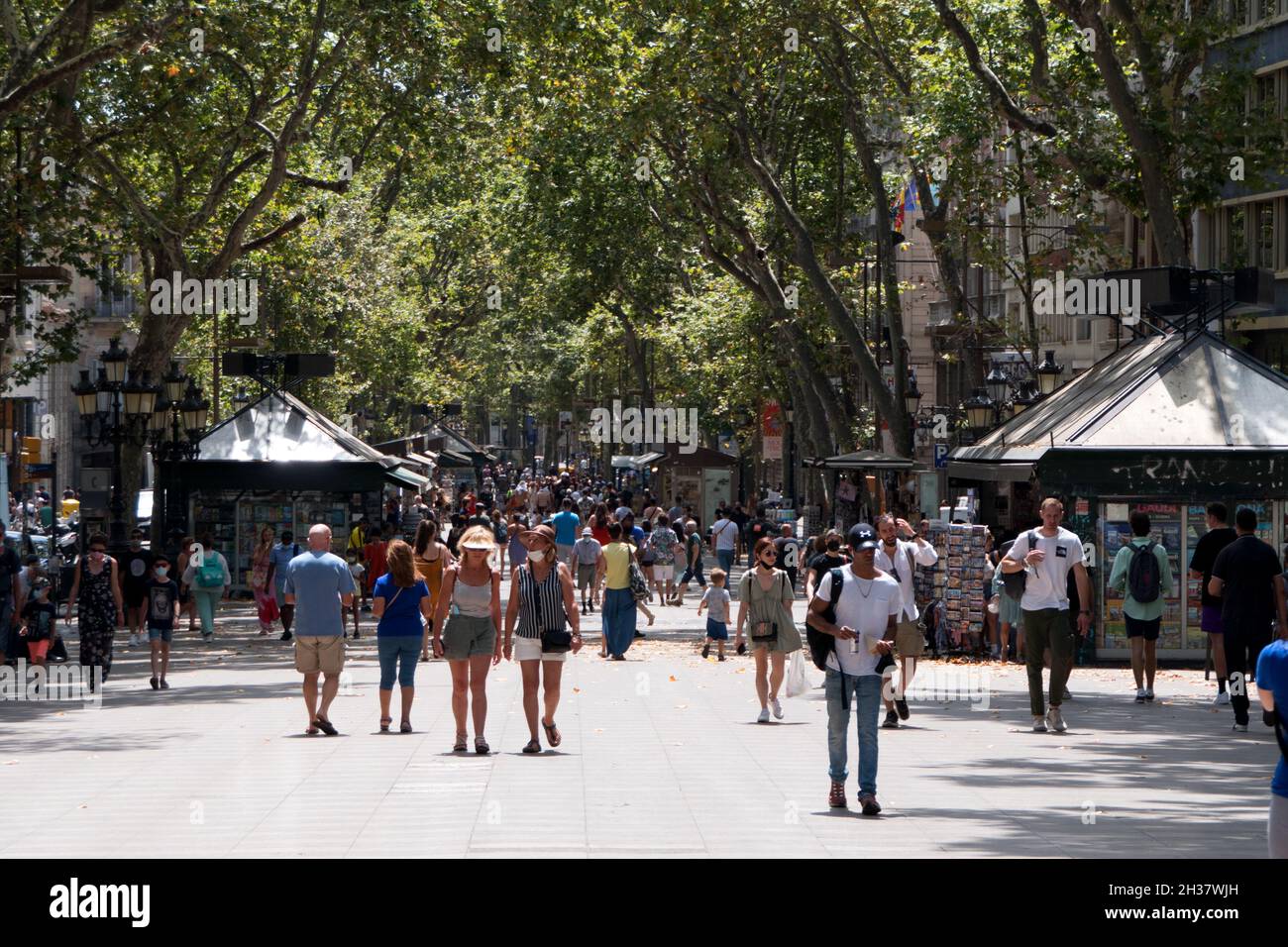 Urban view of Barcelona, Spain with people and tourists walking on La ...