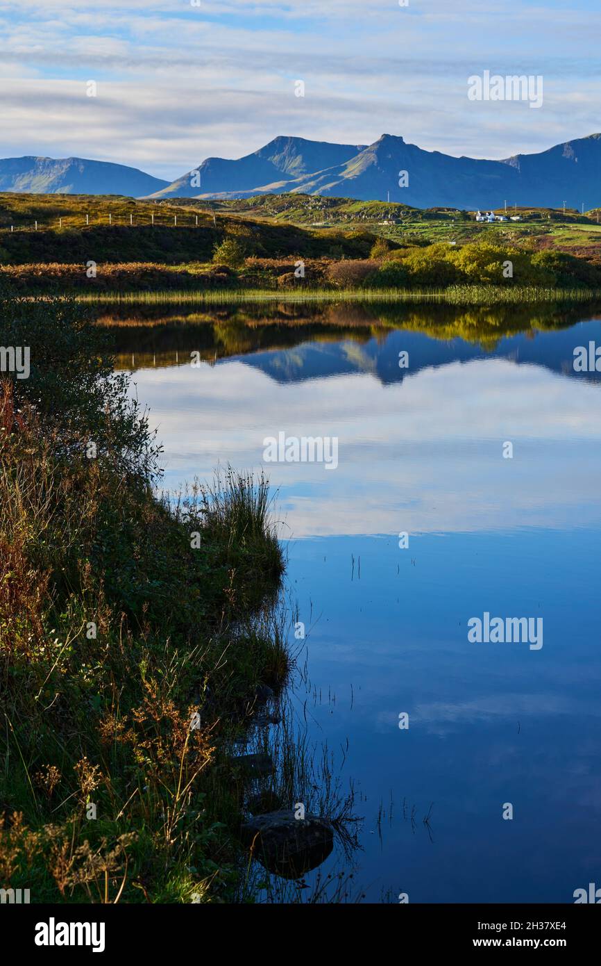 A glassy reflection in Loch Mealt, Isle of Skye Stock Photo - Alamy