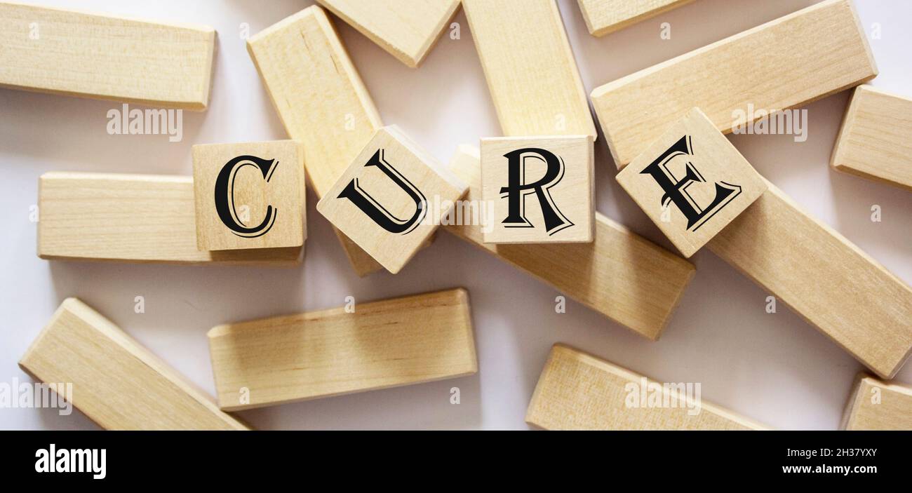 CURE - text on wooden blocks, medical concept, white background Stock ...