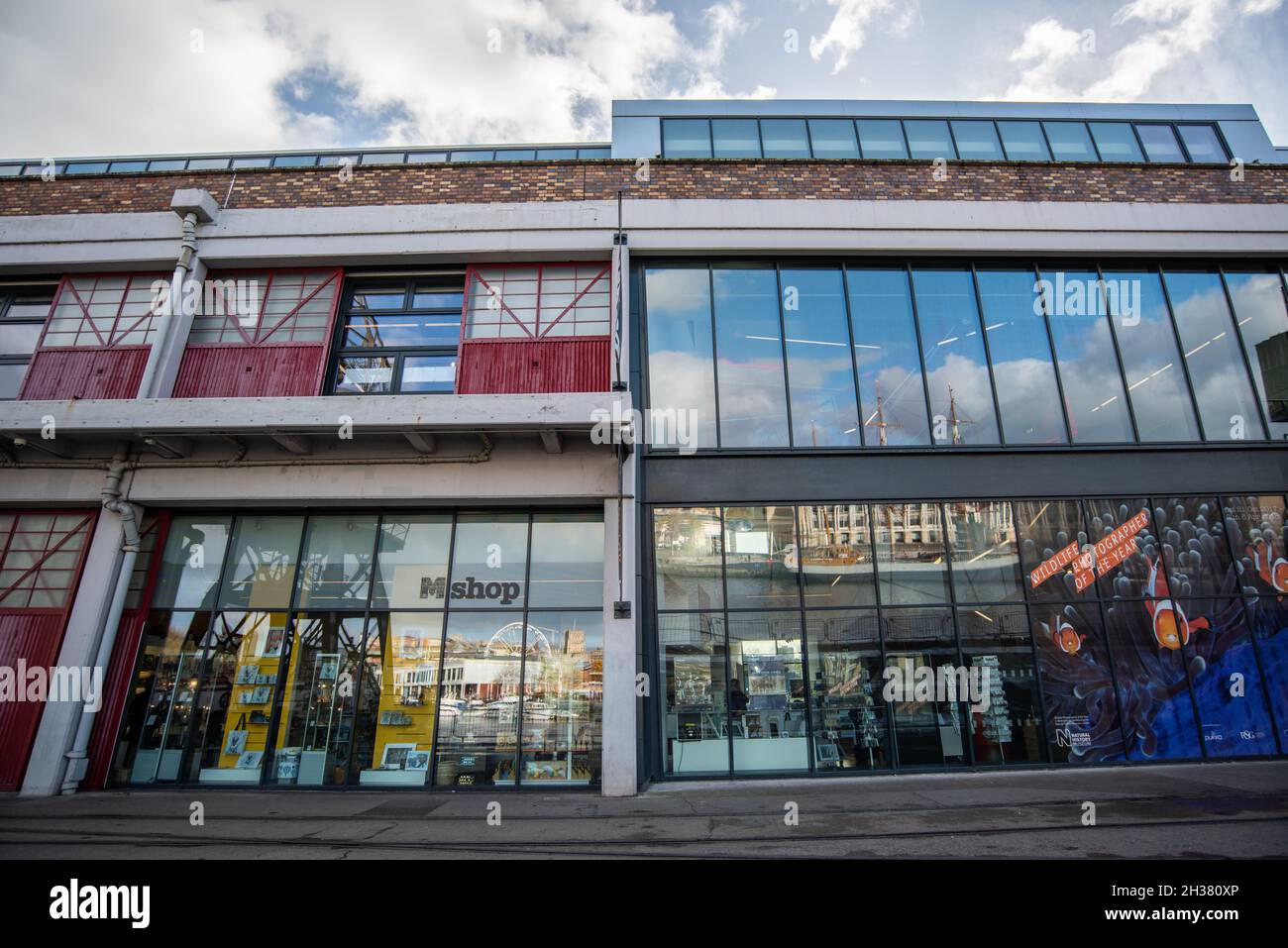 View of some shops and M Shed at Bristol Docks Stock Photo - Alamy