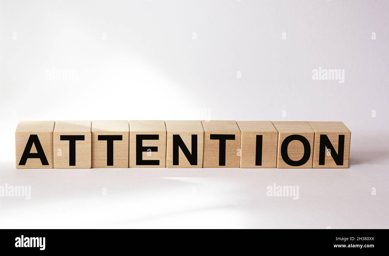 Attention word consisting of building blocks on white background Stock ...