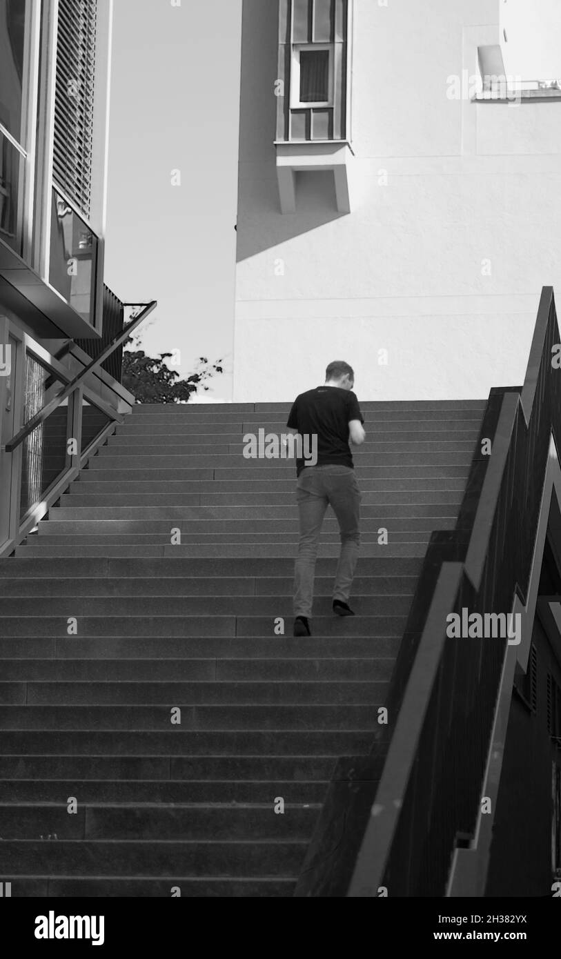 young man go up Stock Photo - Alamy