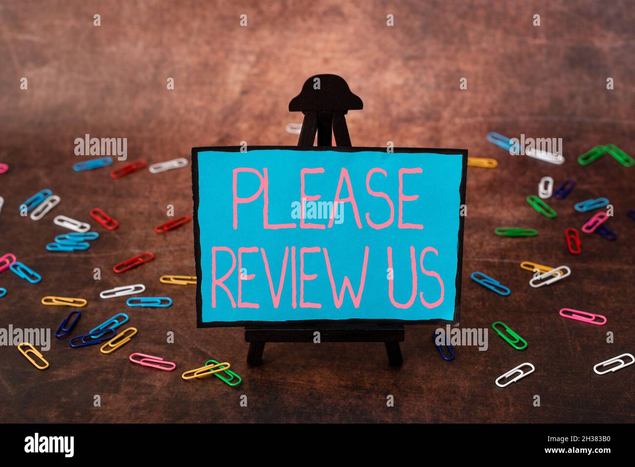 Sign displaying Please Review Us. Word for situation or system is ...