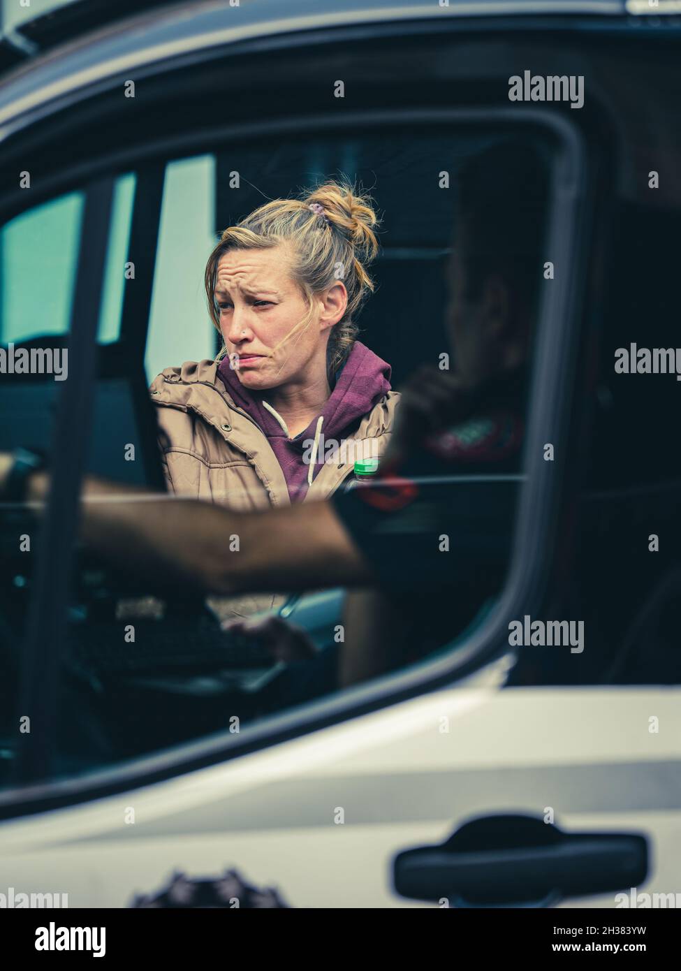 CALGARY, CANADA - Oct 24, 2021: White lady talks to police officers in ...