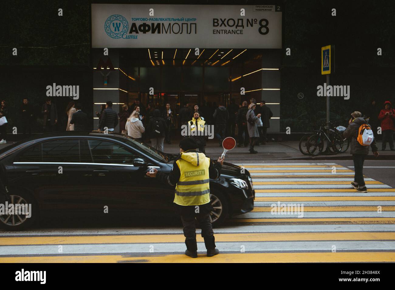 road traffic controller pedestrian crossing Moscow city .crowd of busy ...